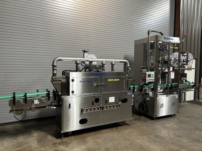 2016 SAEHAN HIGH SPEED SLEEVER, BOTTLE LABELER WITH STEAM TUNNEL
